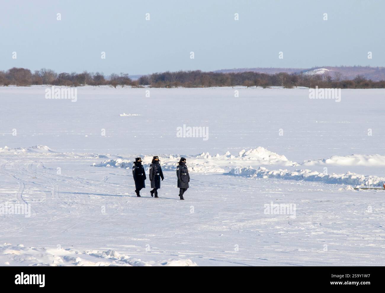 Border police patrol the Huma section of the China-Russia border River ...