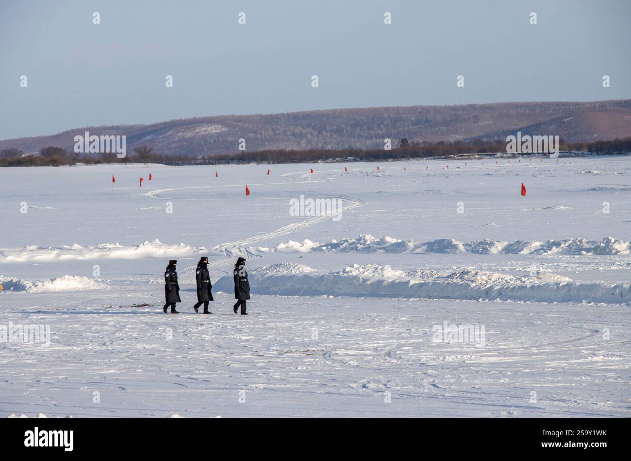Border police patrol the Huma section of the China-Russia border River ...