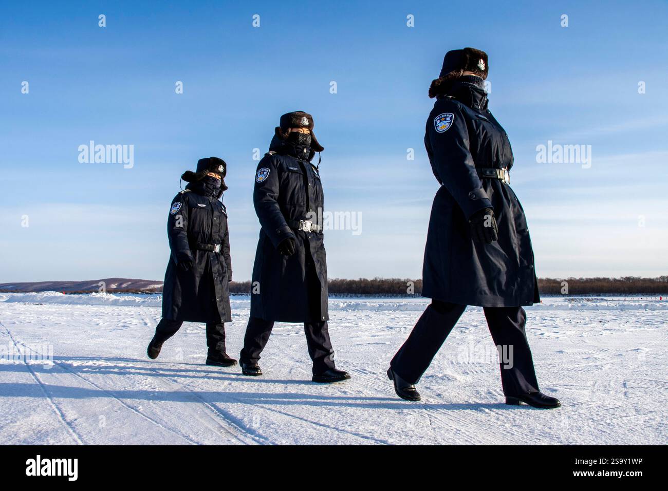 Border police patrol the Huma section of the China-Russia border River ...