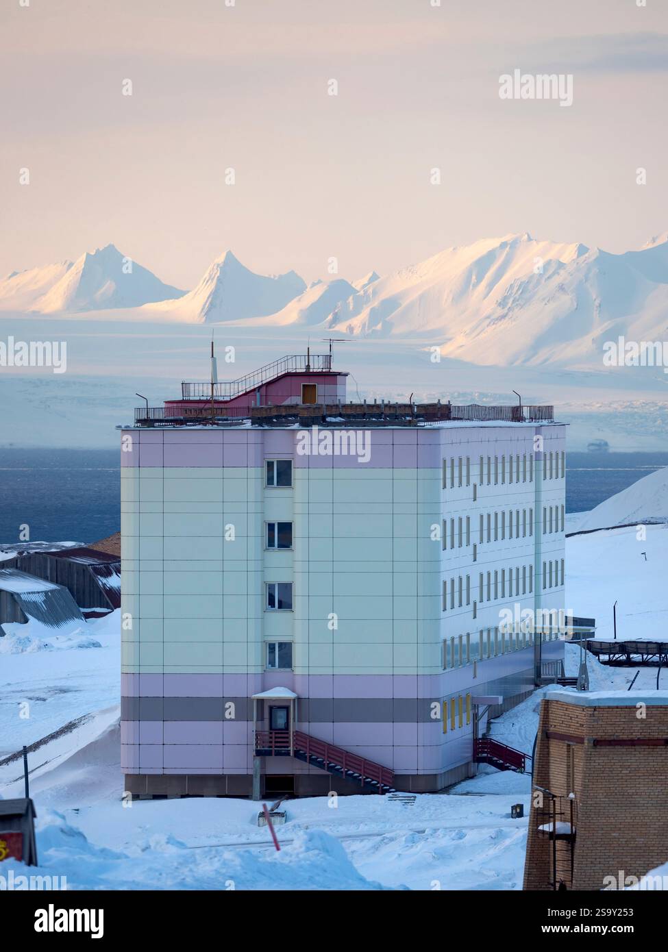 Residential building. Russian coal mining town Barentsburg at fjord ...