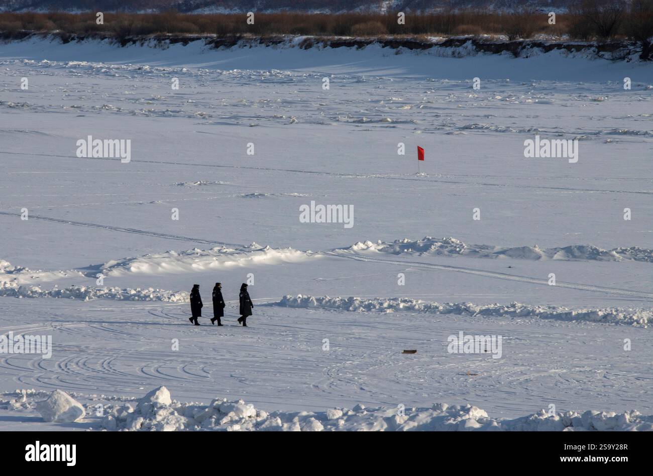 Border police patrol the Huma section of the China-Russia border River ...