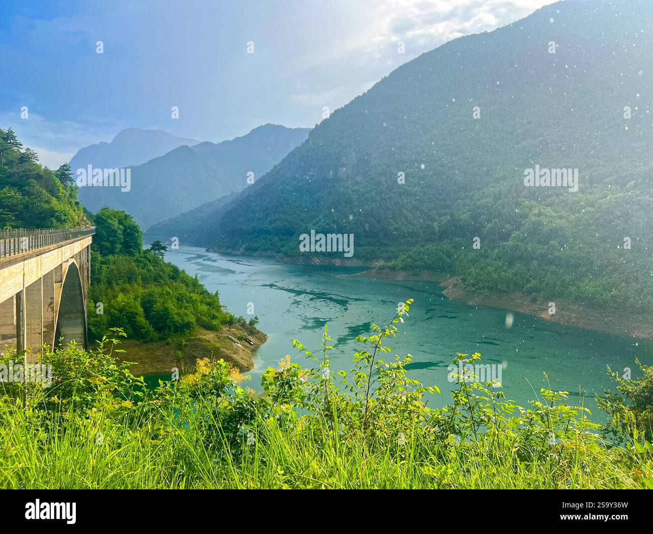 Valvestino lake and Recchi bridge on summer rainy day, Italy Stock ...
