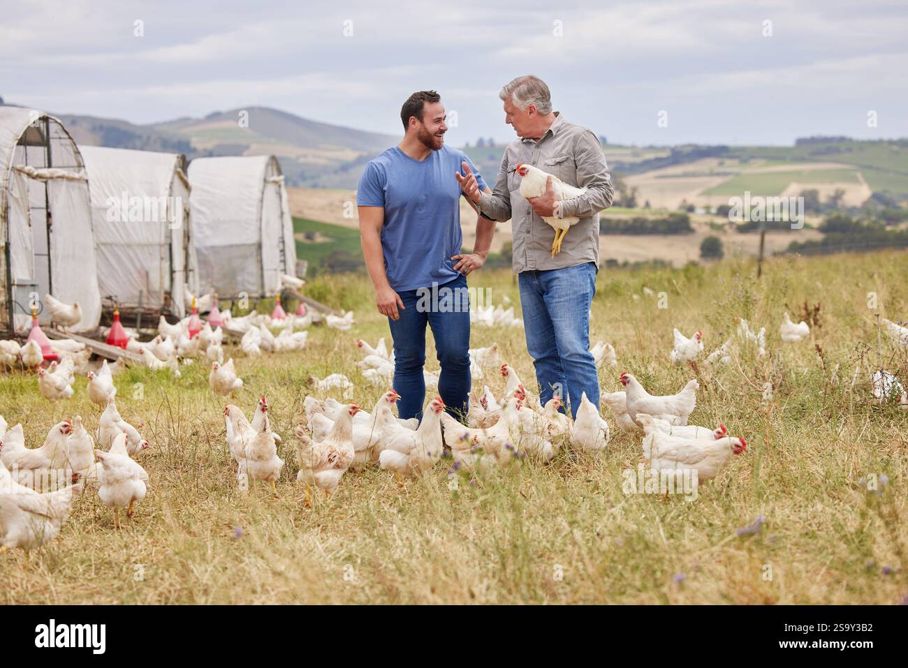 Smile, father and son with chickens at poultry farm for family business ...