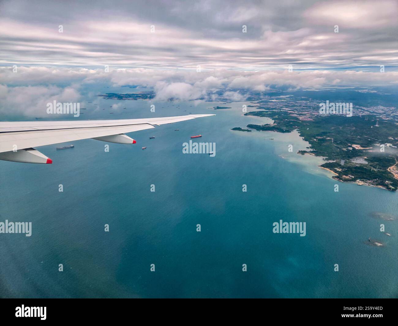 Landing view of Singapore port from aeroplane window Stock Photo - Alamy