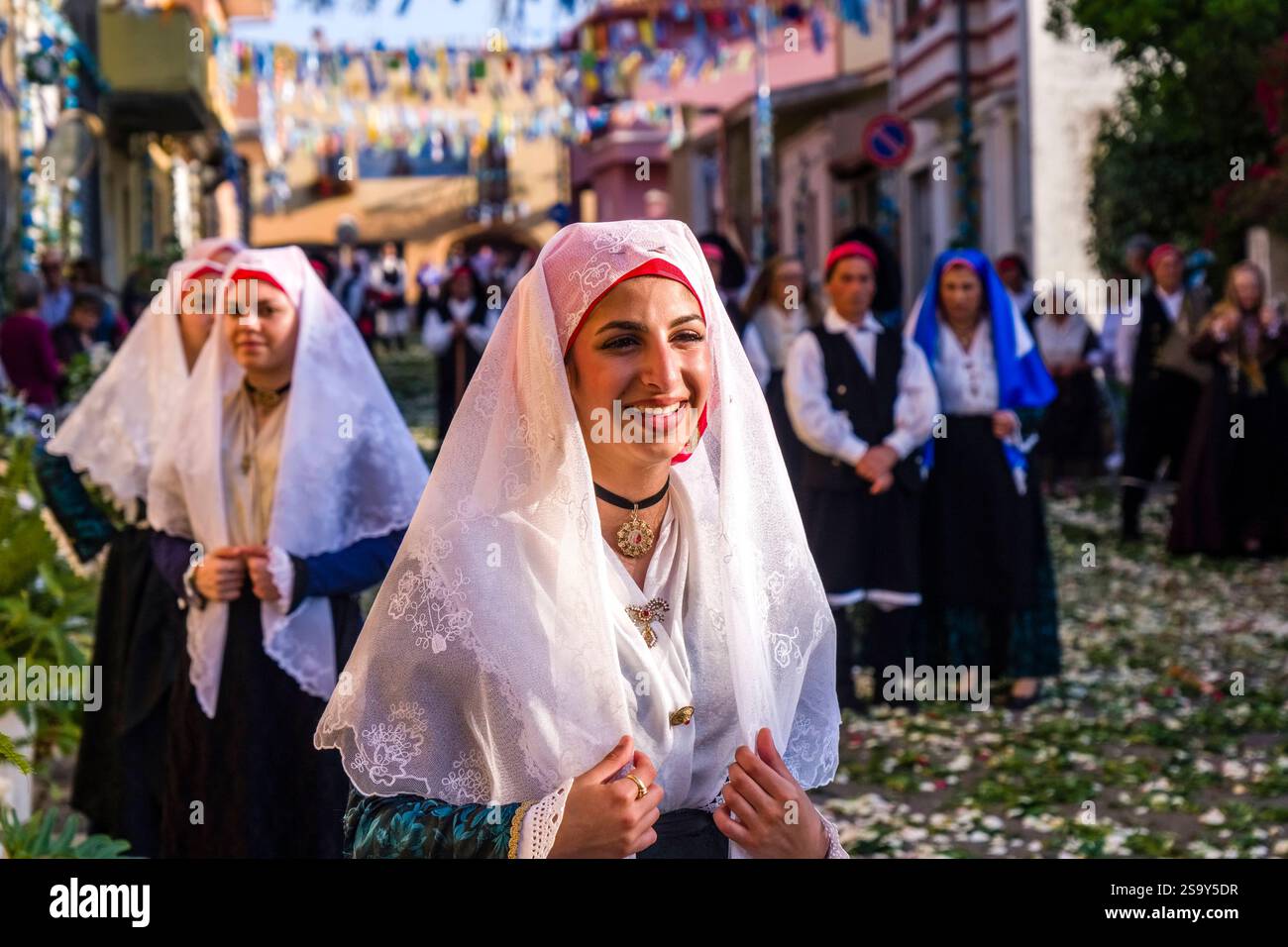 Portrait of a traditionally dressed young woman, walking through the ...