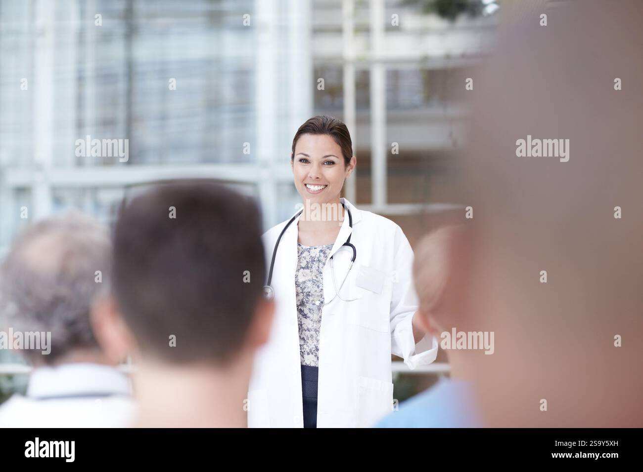 Doctor, presentation and speech with medical woman in hospital for ...