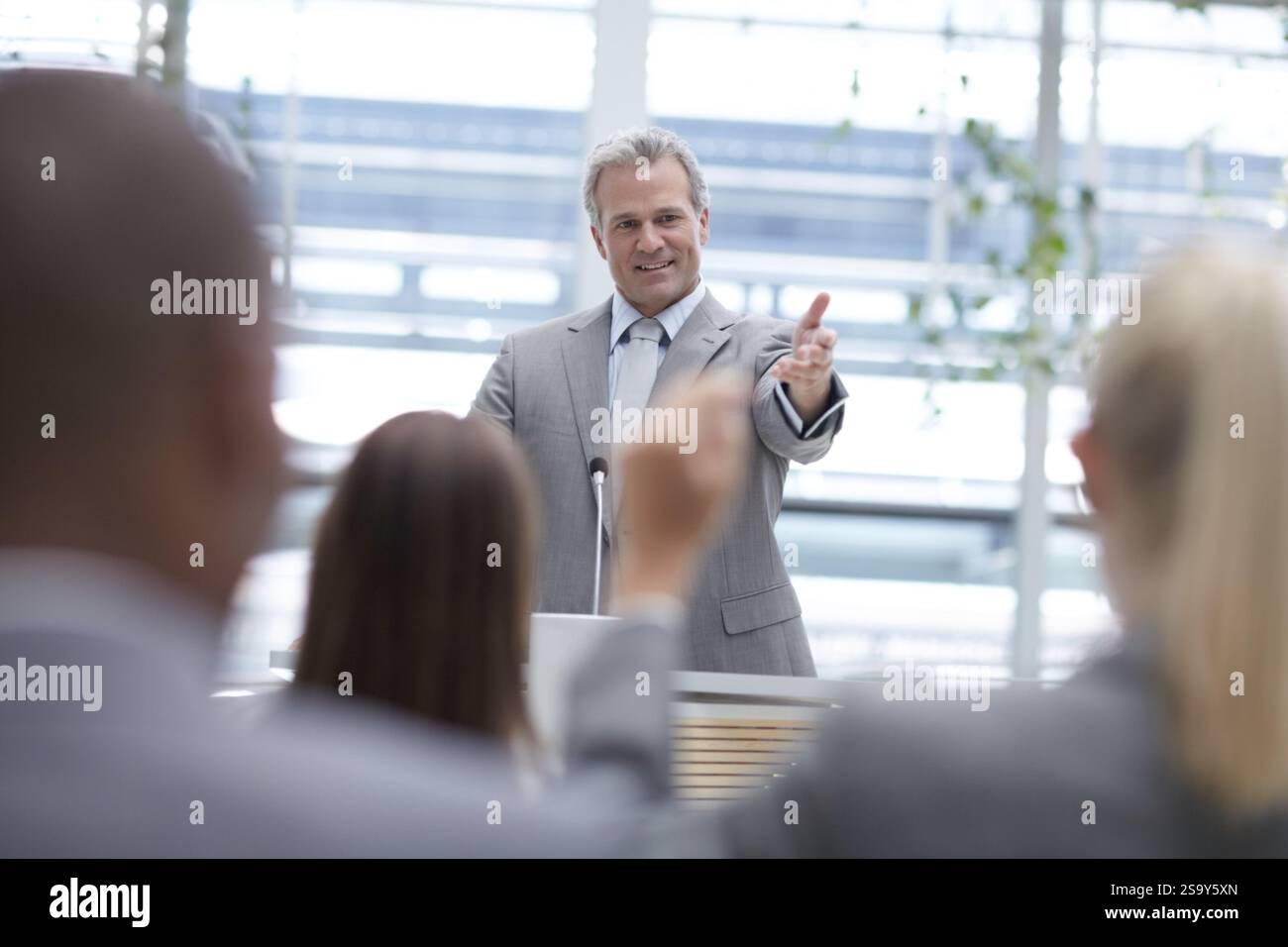 Conference, seminar and speaker with business man in auditorium of ...