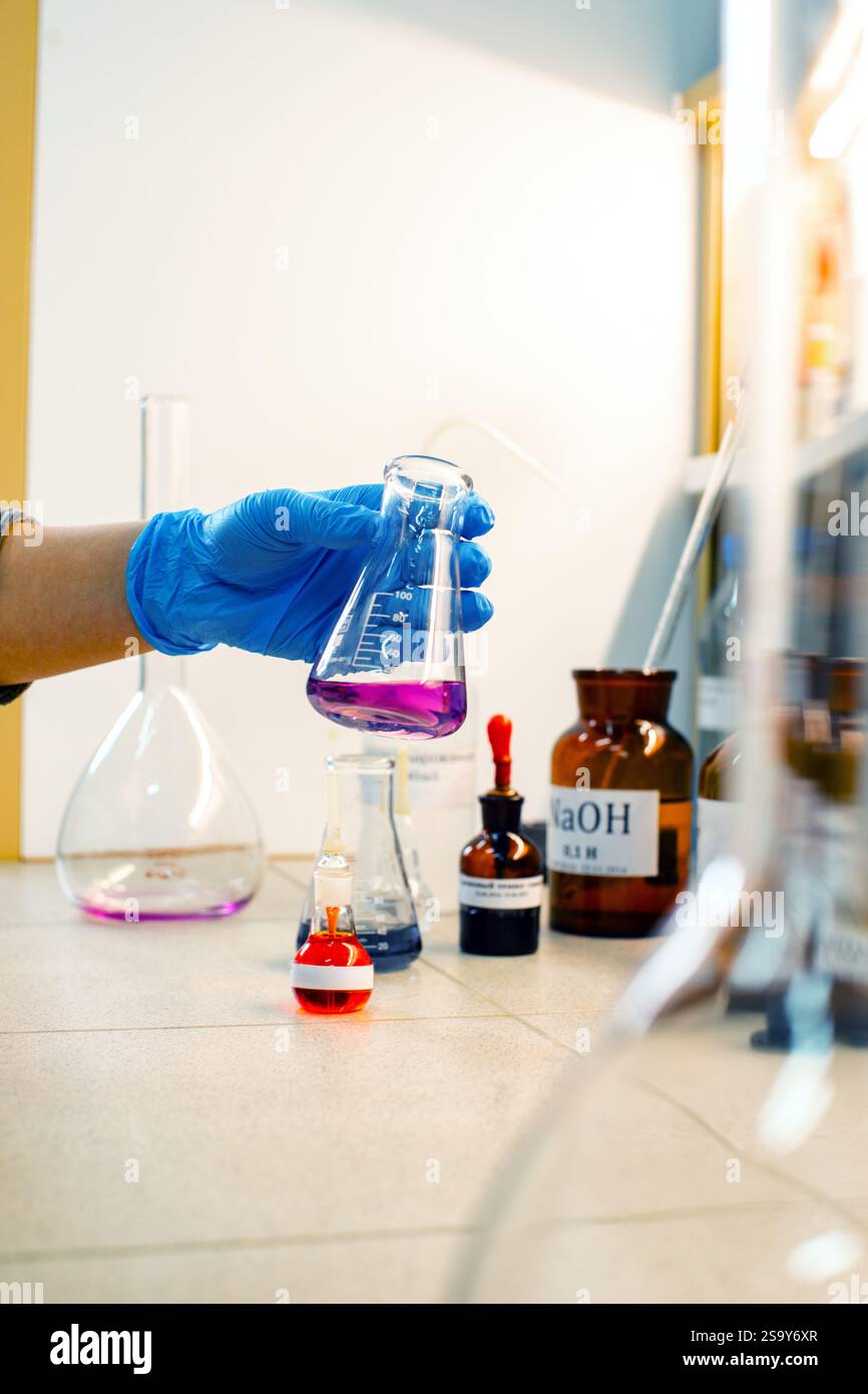 Laboratory experiment involving colorful chemical reactions in a research setting during a ...
