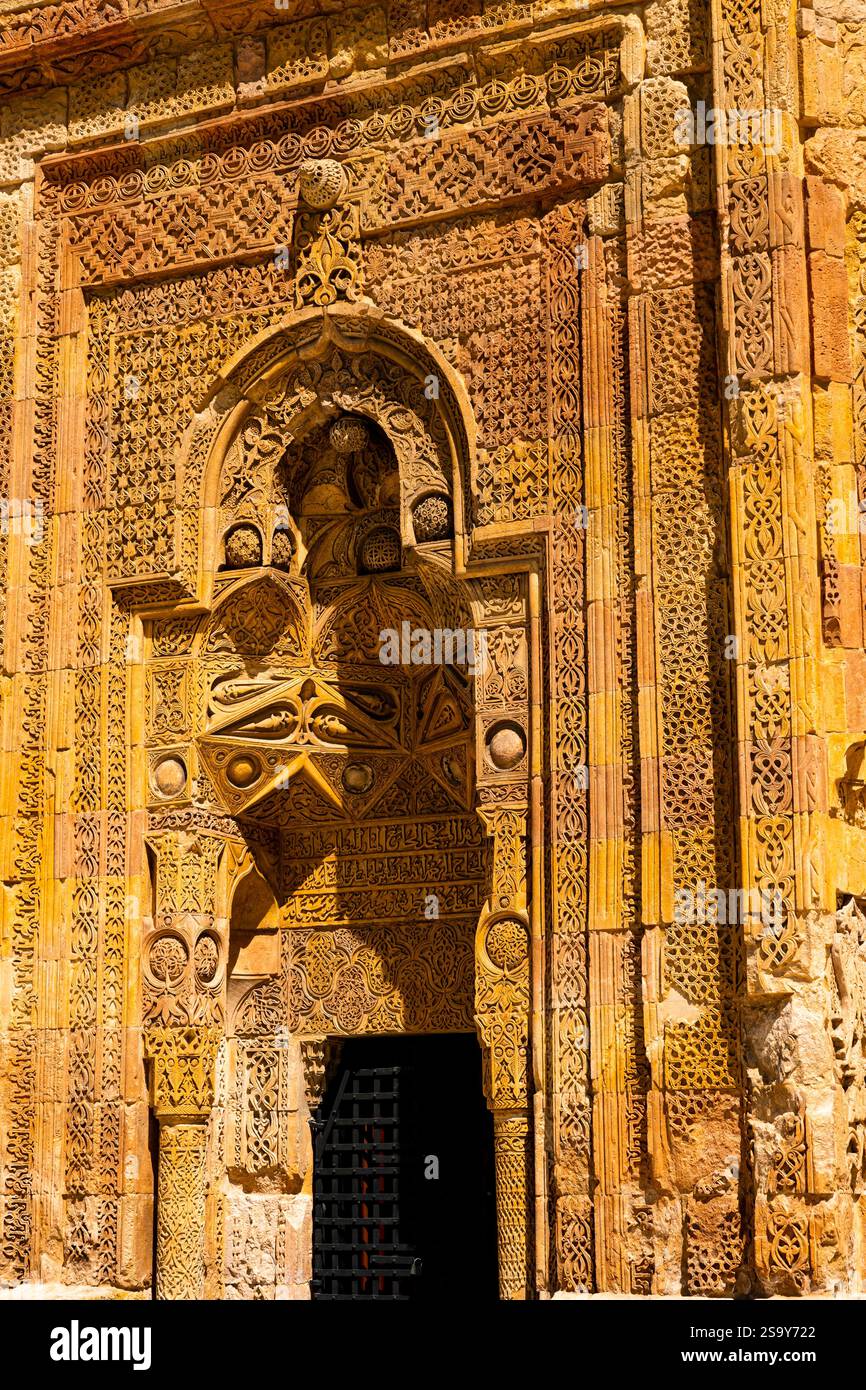 Shadow of a praying man on the gate of Great Mosque of Divrigi or ...