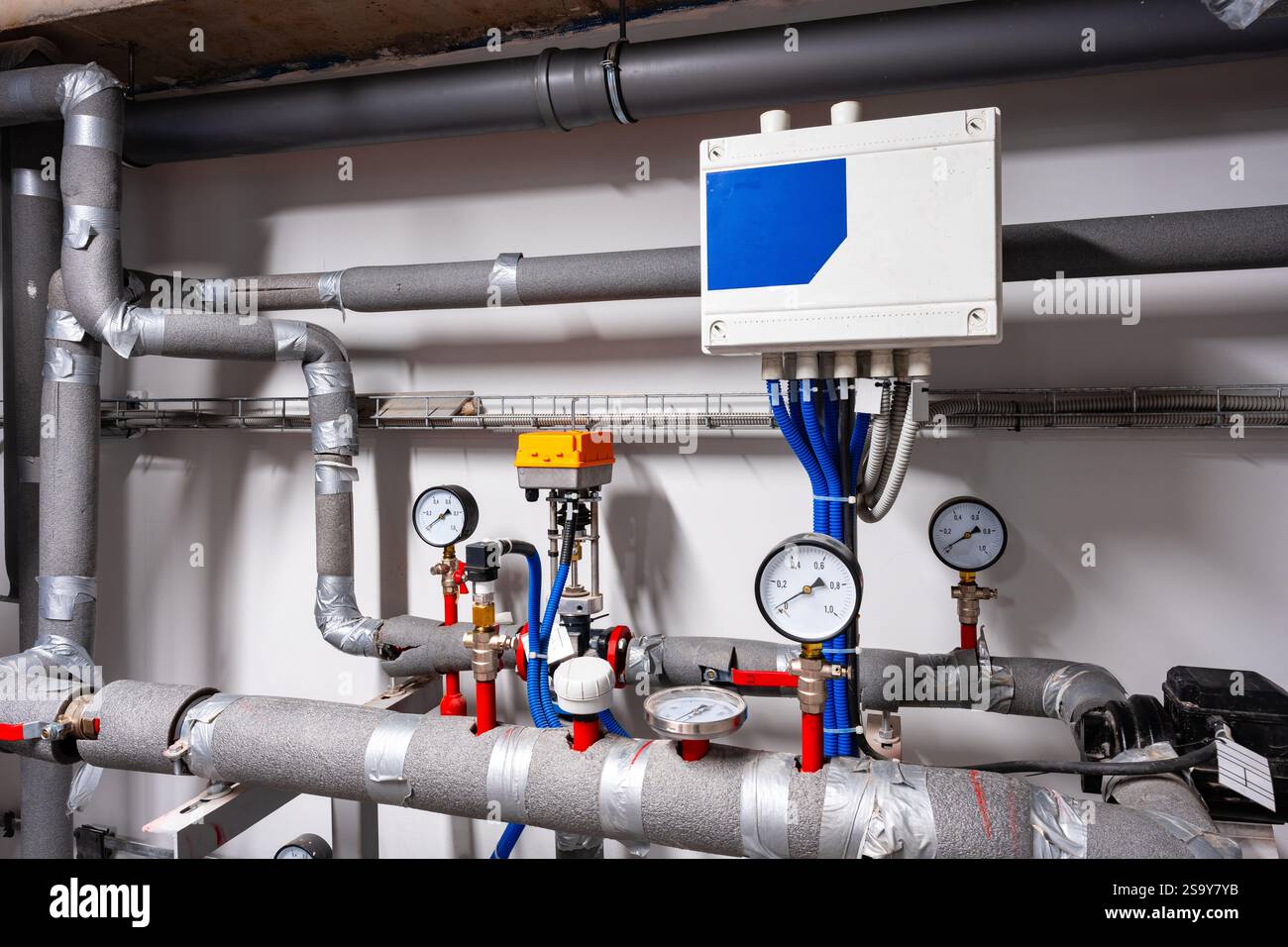 Industrial piping system with pressure gauges and control equipment in ...