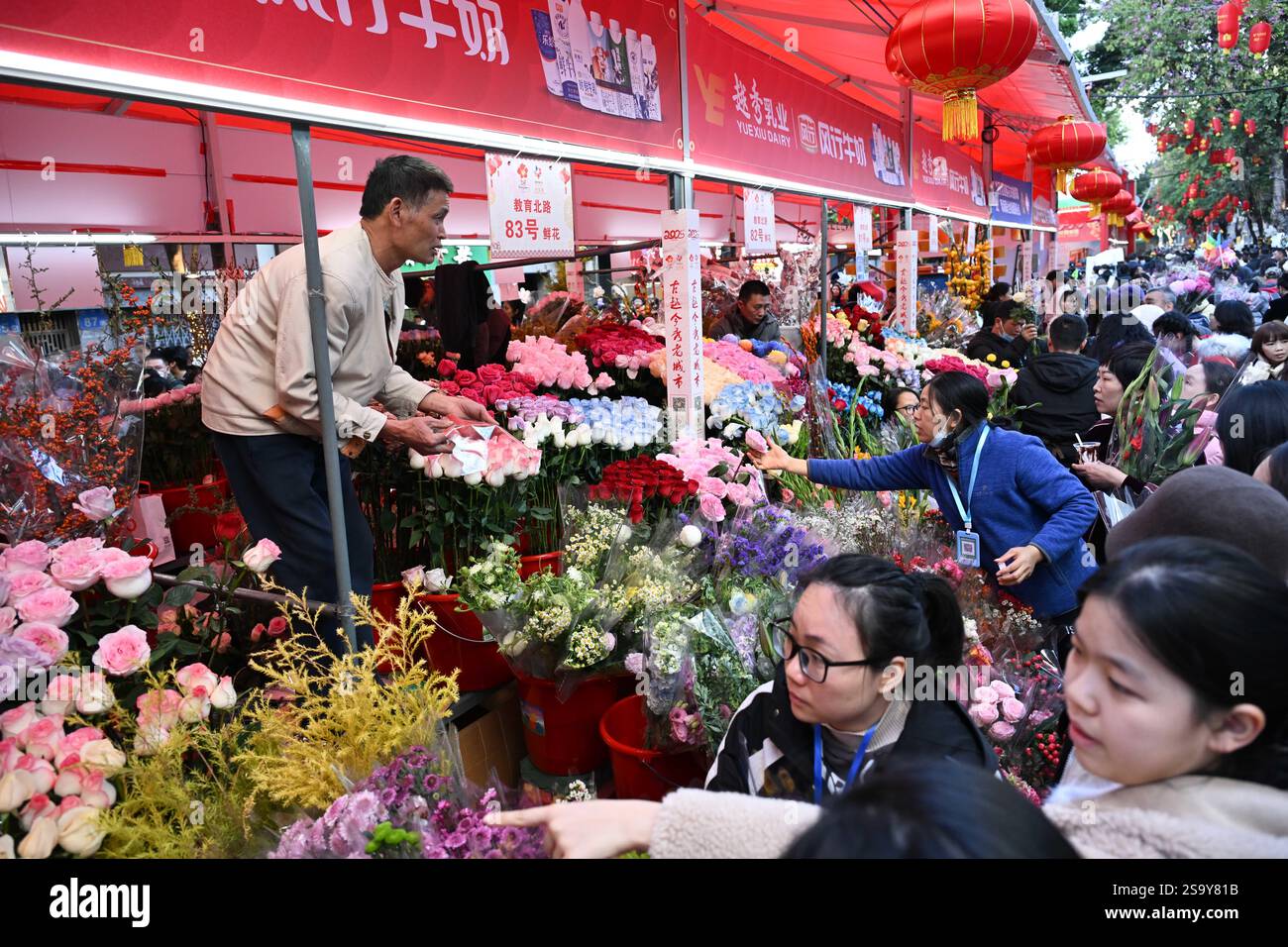 Beijing, China's Guangdong Province. 27th Jan, 2025. Residents shop at ...