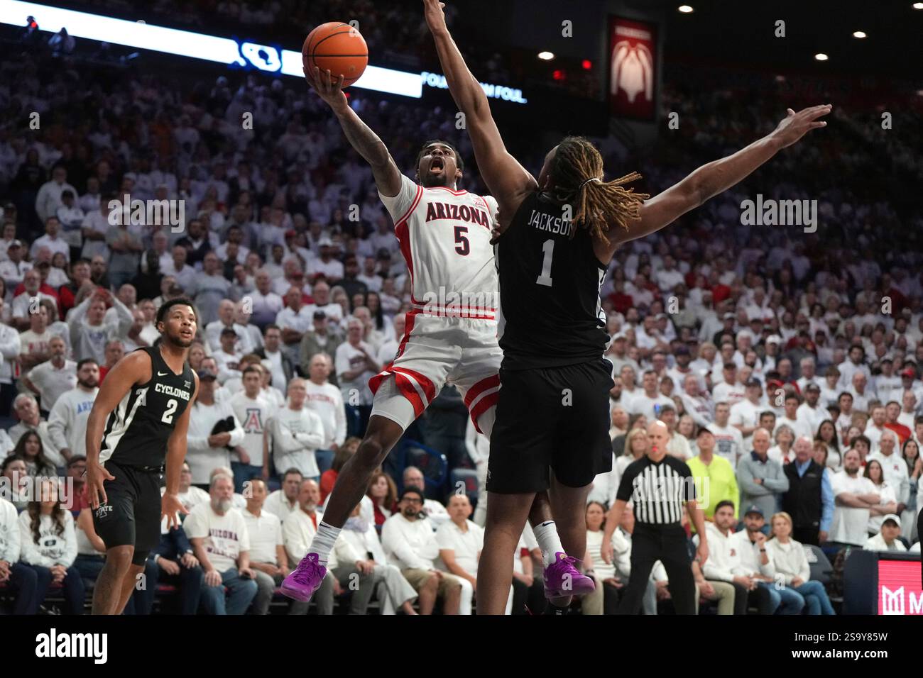 Arizona guard KJ Lewis (5) drives past Iowa State center Dishon Jackson ...