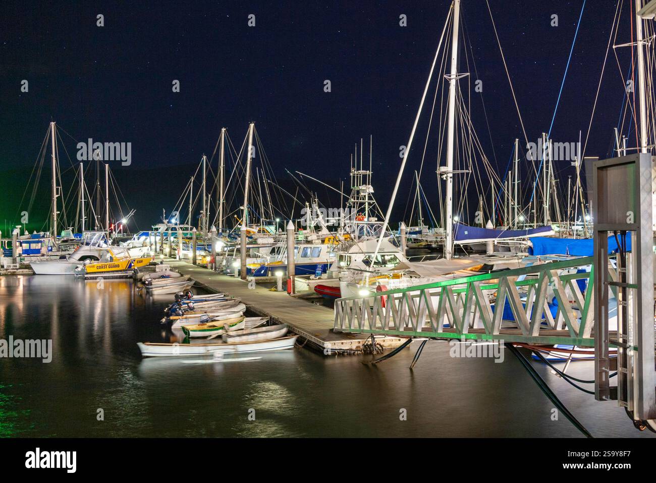cairns marina pier by night boats launches yachts at wharf calm water ...