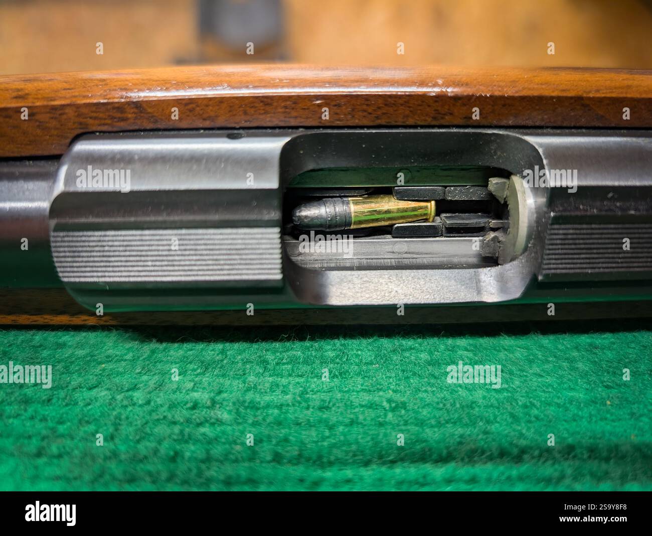 A small caliber rifle with a cartridge in the magazine, close-up, at a ...