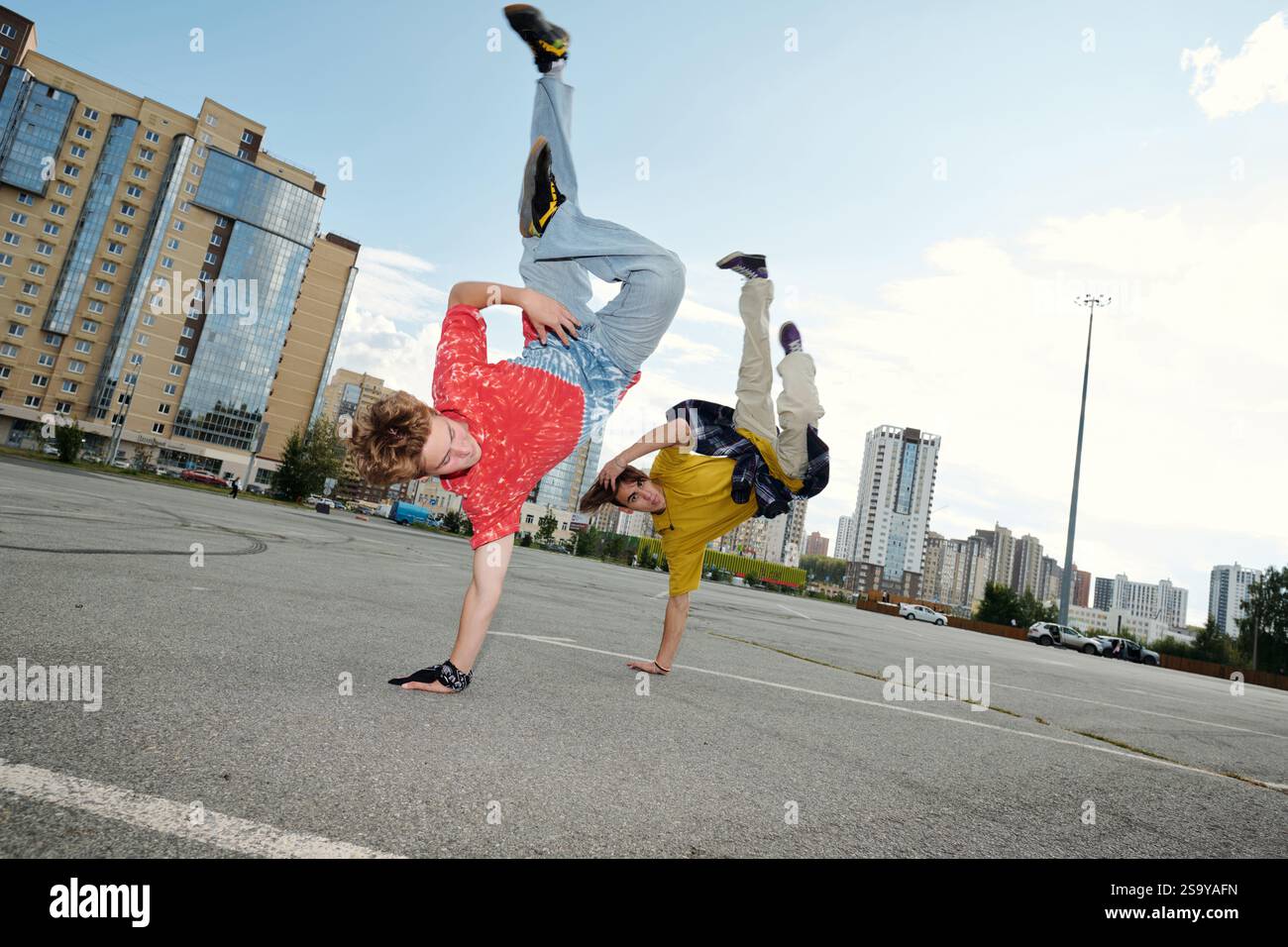 Breakdancers Performing Handstands in Urban Environment Stock Photo - Alamy