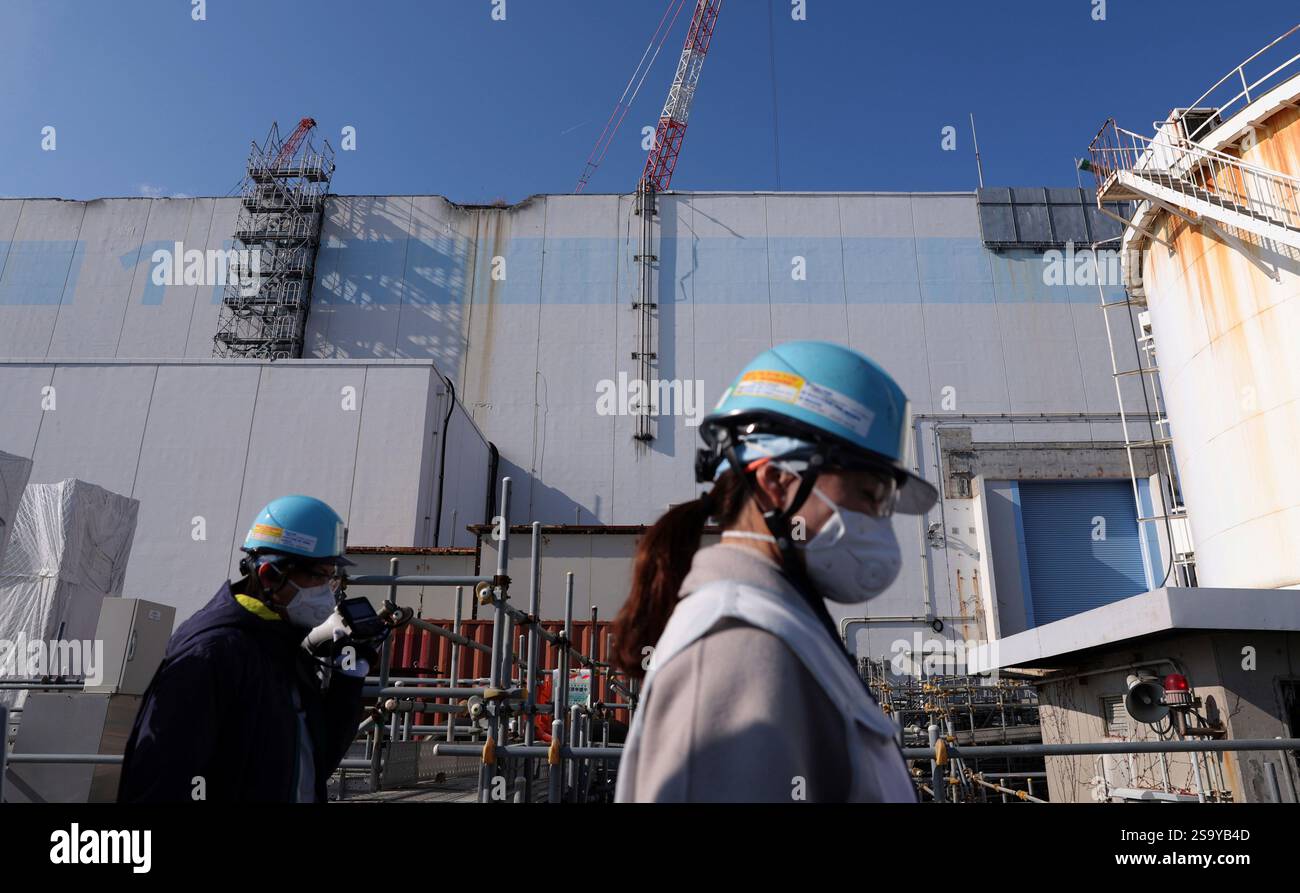 A photo shows the Fukushima Daiichi Nuclear Power Plant Unit 1, where a ...
