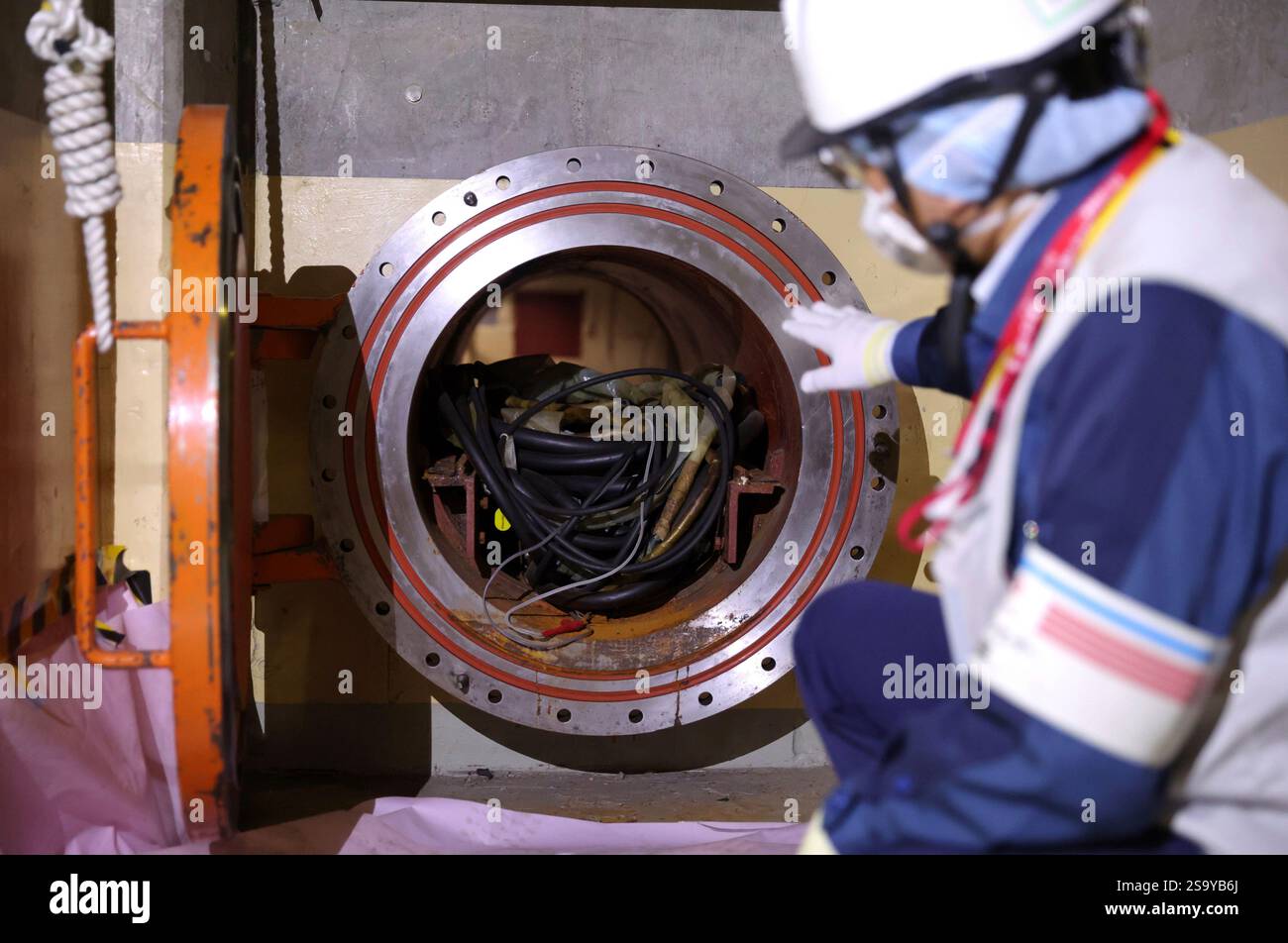 A photo shows X-6 Penetration, a work hole opened in the containment ...