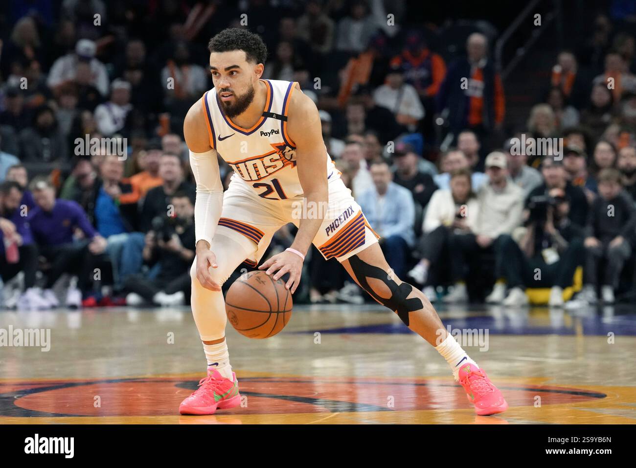 Phoenix Suns guard Tyus Jones dribbles the ball against the Los Angeles ...