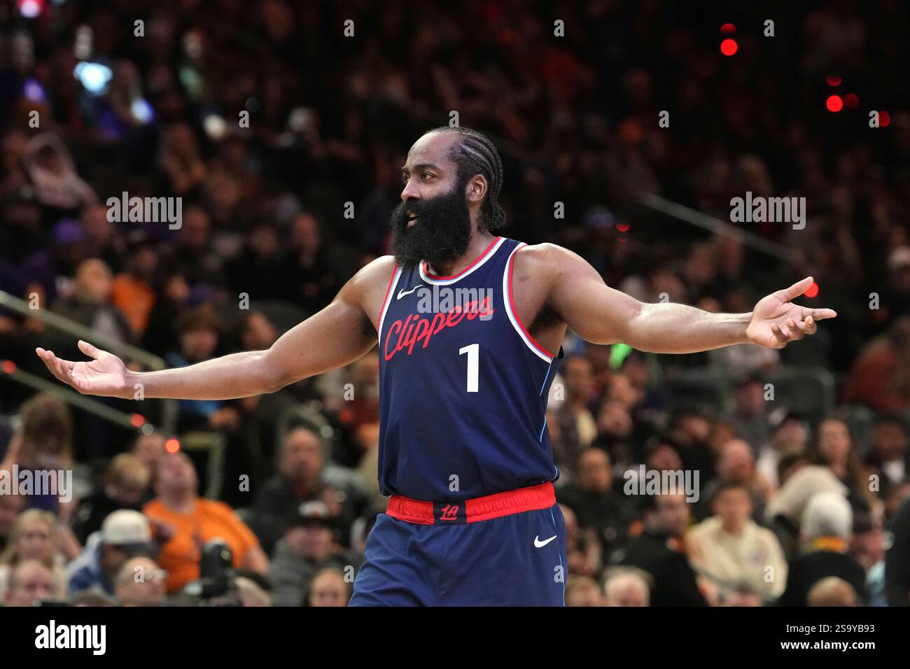 Los Angeles Clippers guard James Harden tries to get the crowd to cheer ...