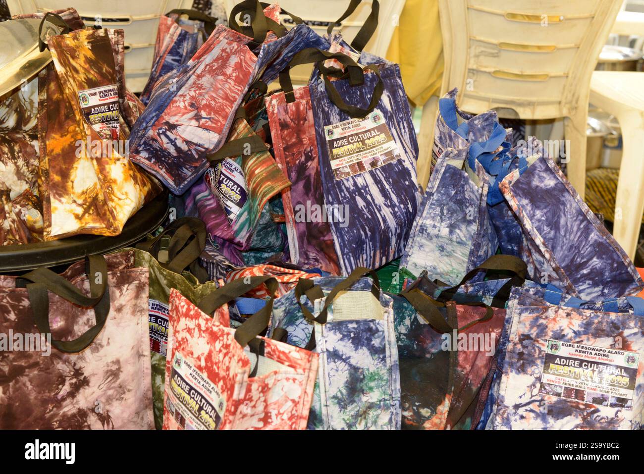 Bags made with Adire materials are heaped on the floor during the grand ...