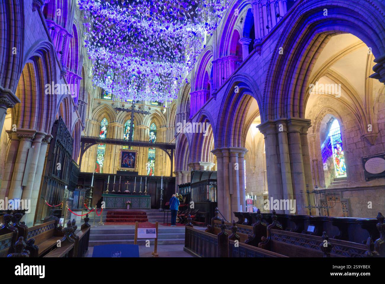 Internal photograph of 12th century Hexham Abbey with origami 'stars ...