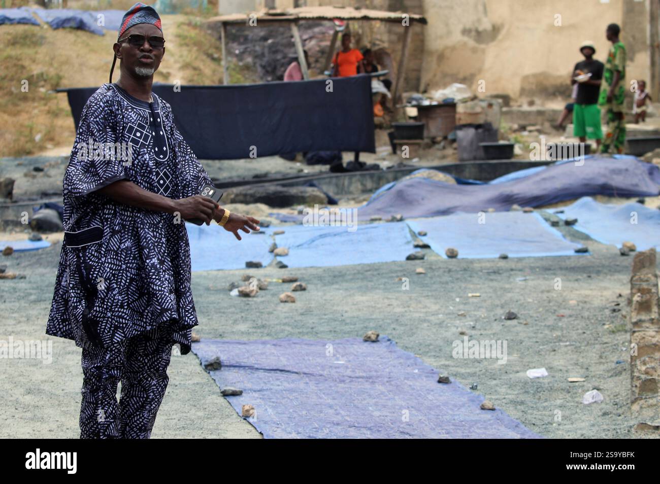 Zulika Badmos, Balogun of Kemta Adire/Kampala Market, Itoku, explains the processes of making ...