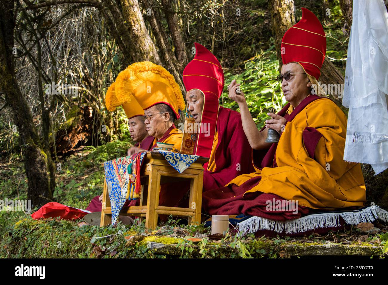 Sang Sang Rimpoche conducts puja at the spring below Chiwong Monastery ...