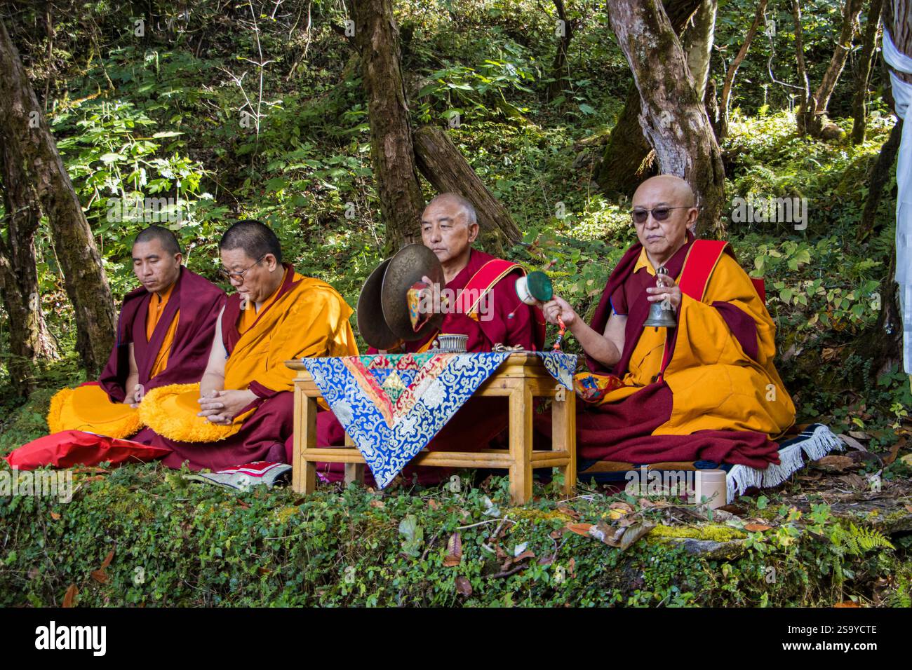 Sang Sang Rimpoche conducts puja at the spring below Chiwong Monastery ...