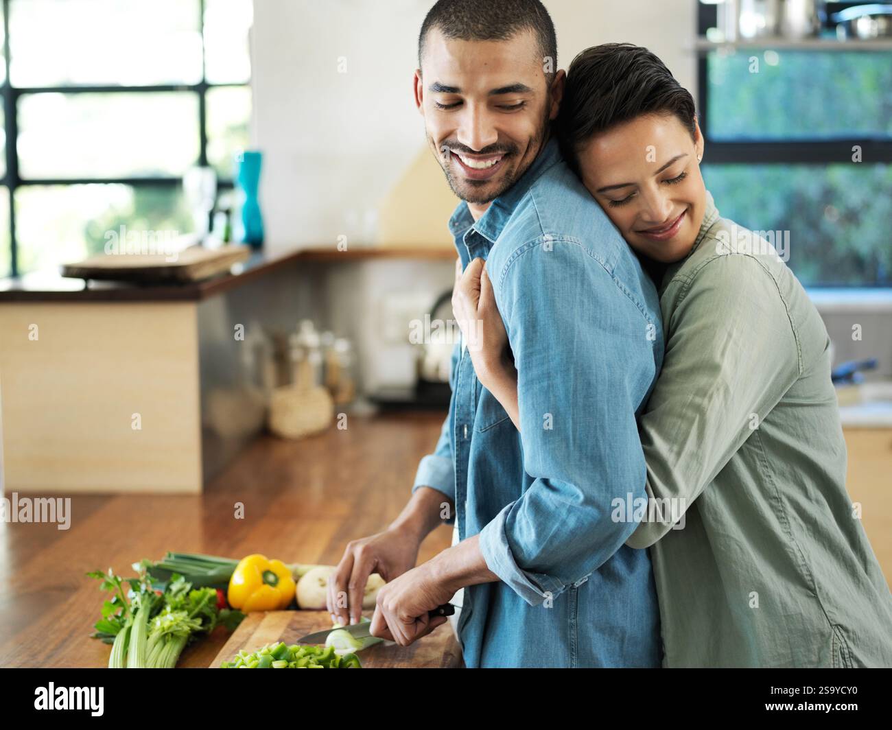 Smile, couple and cooking with hug in kitchen for love, relationship ...
