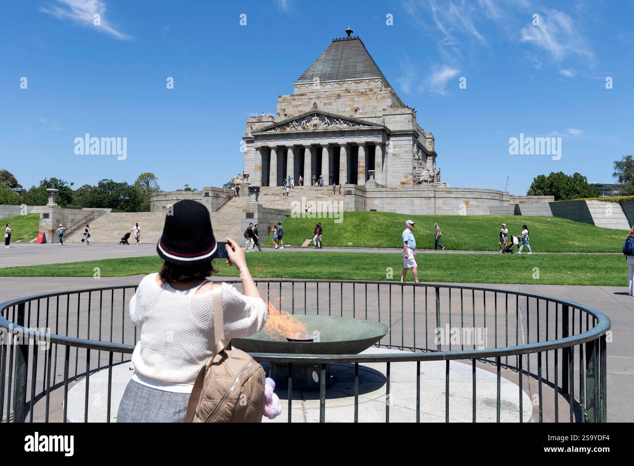 Asian woman tourist takes photo of The Eternal Flame and Shrine of ...