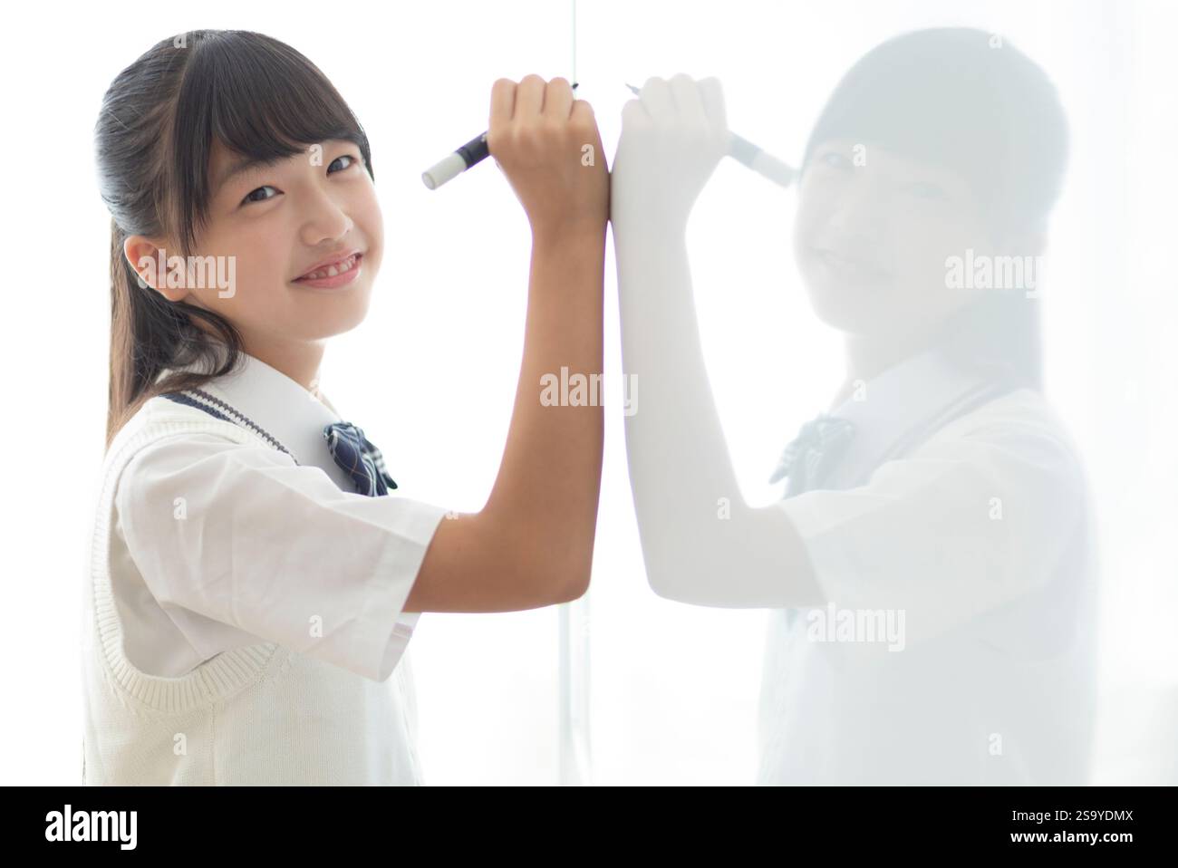 Secondary school students writing on whiteboard Stock Photo - Alamy