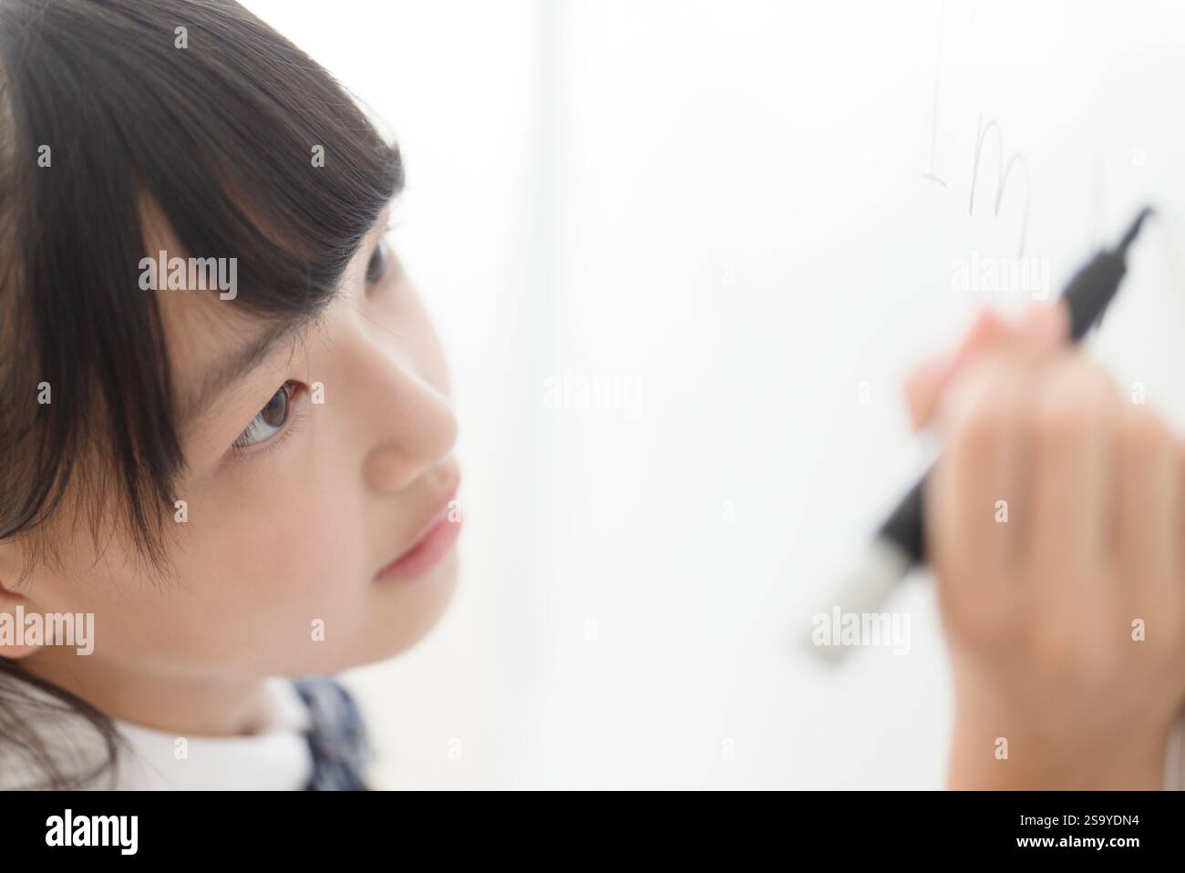 Secondary school students writing on whiteboard Stock Photo - Alamy