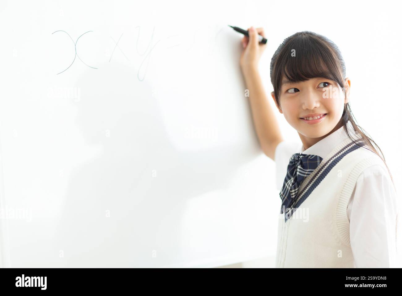 Secondary school students writing on whiteboard Stock Photo - Alamy