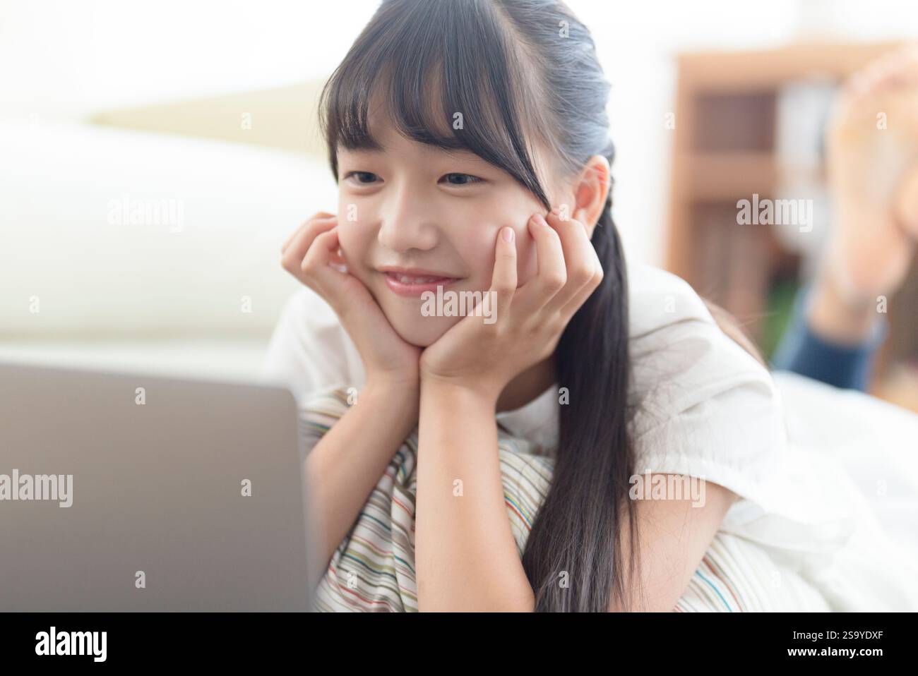 Secondary school student looking at a computer Stock Photo - Alamy