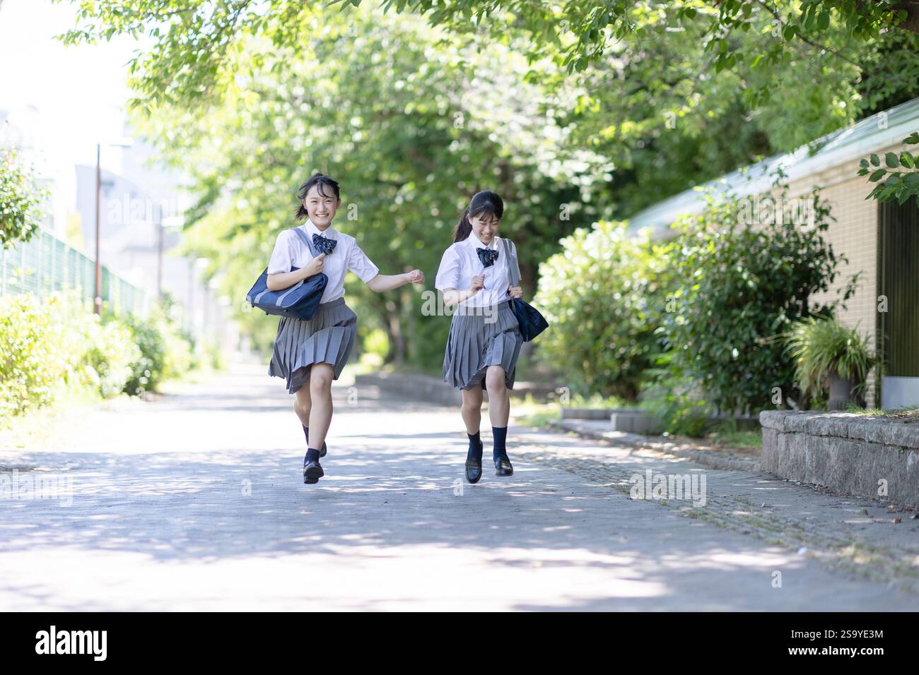 Running home after school hi-res stock photography and images - Alamy