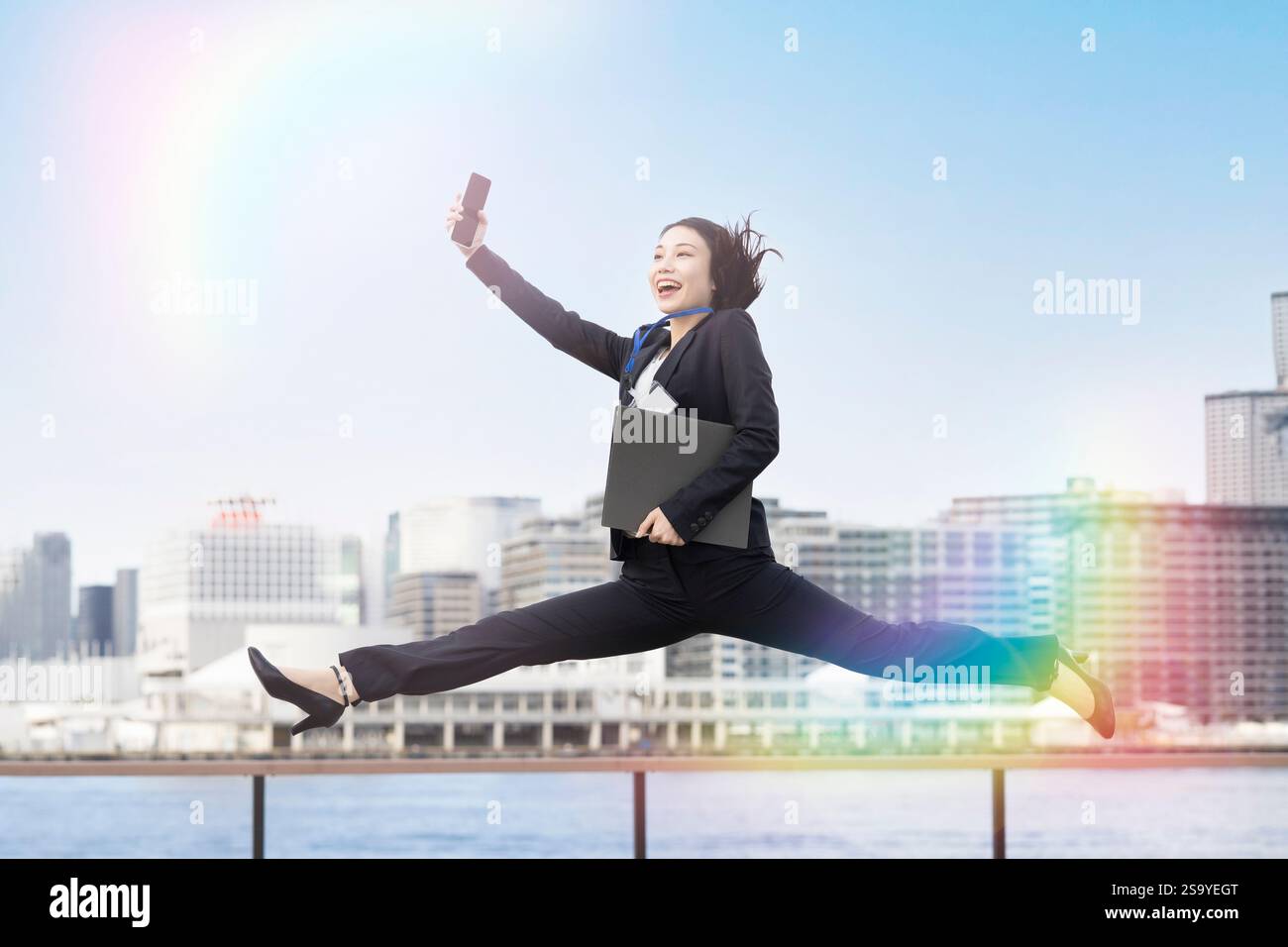 Young businesswoman/jobseeker jumping with a smile Stock Photo - Alamy