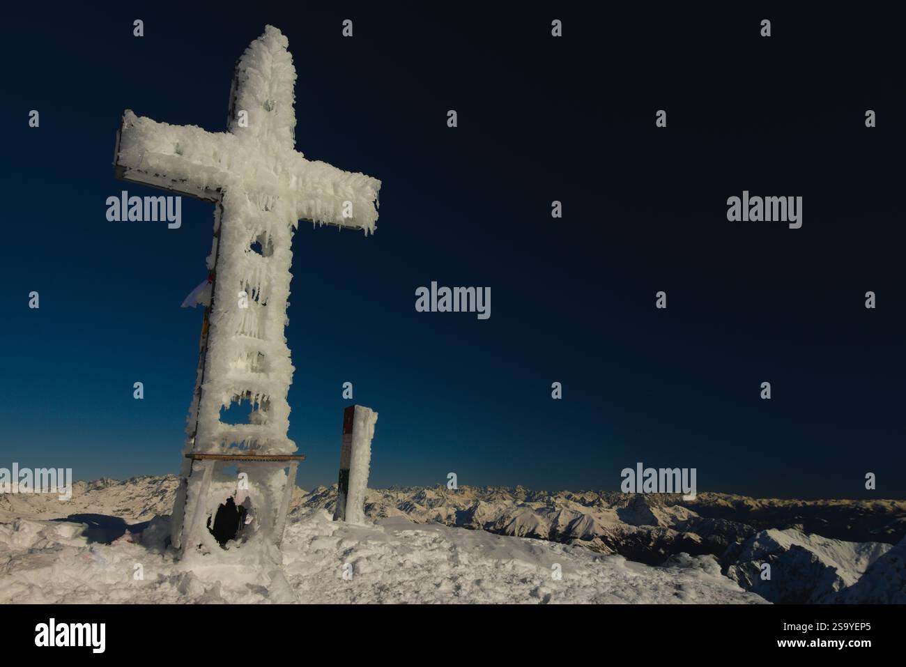 Frozen cross on the top of mount Pizzo Arera (2,512 metres - 8,241 ft ...