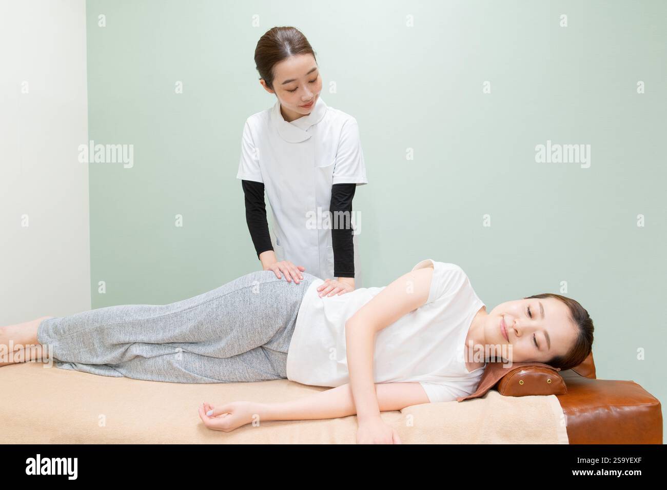 Bodywork, massage, lower back and pelvis Stock Photo - Alamy