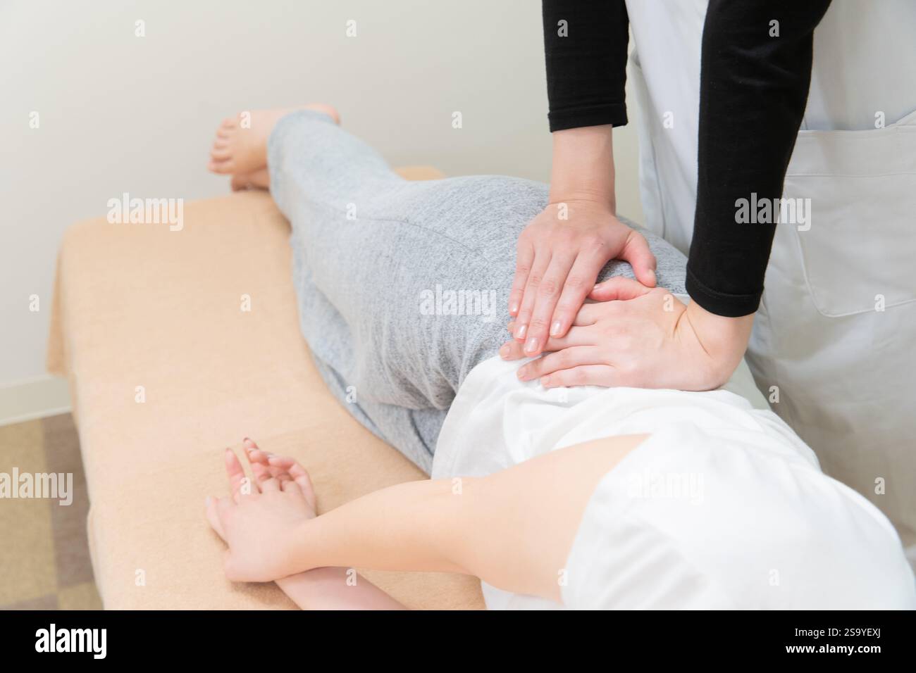 Bodywork, massage, lower back and pelvis Stock Photo - Alamy