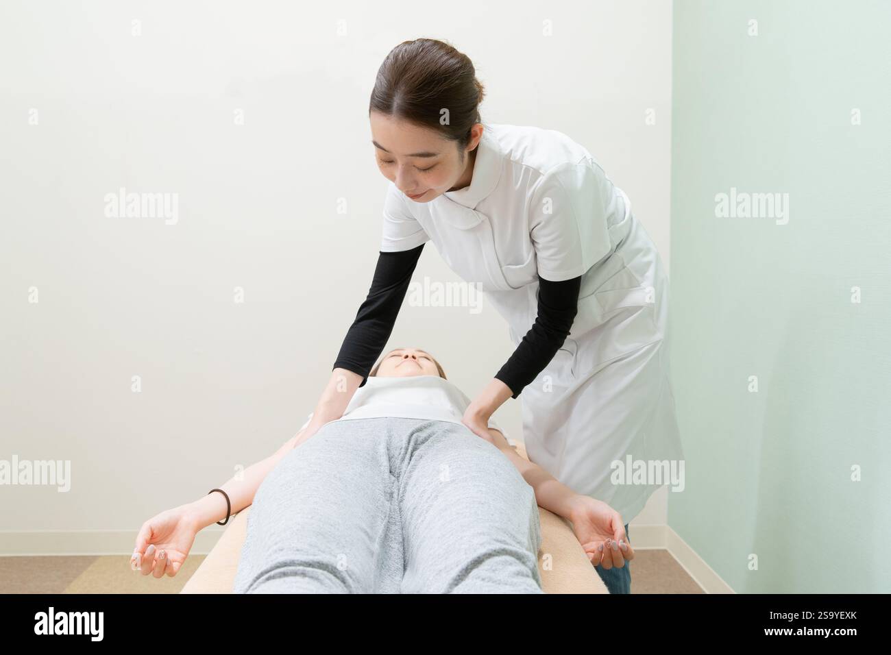 Bodywork, massage, lower back and pelvis Stock Photo - Alamy