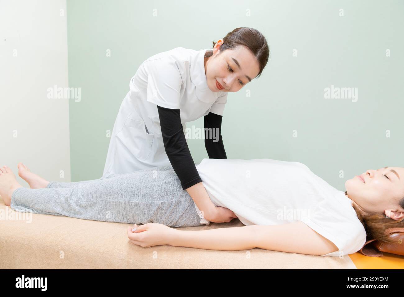 Bodywork, massage, lower back and pelvis Stock Photo - Alamy
