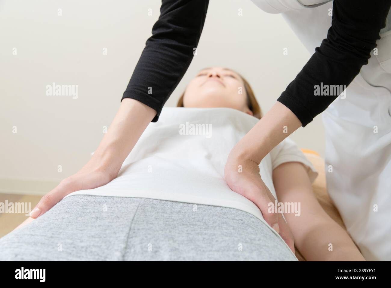 Bodywork, massage, lower back and pelvis Stock Photo - Alamy