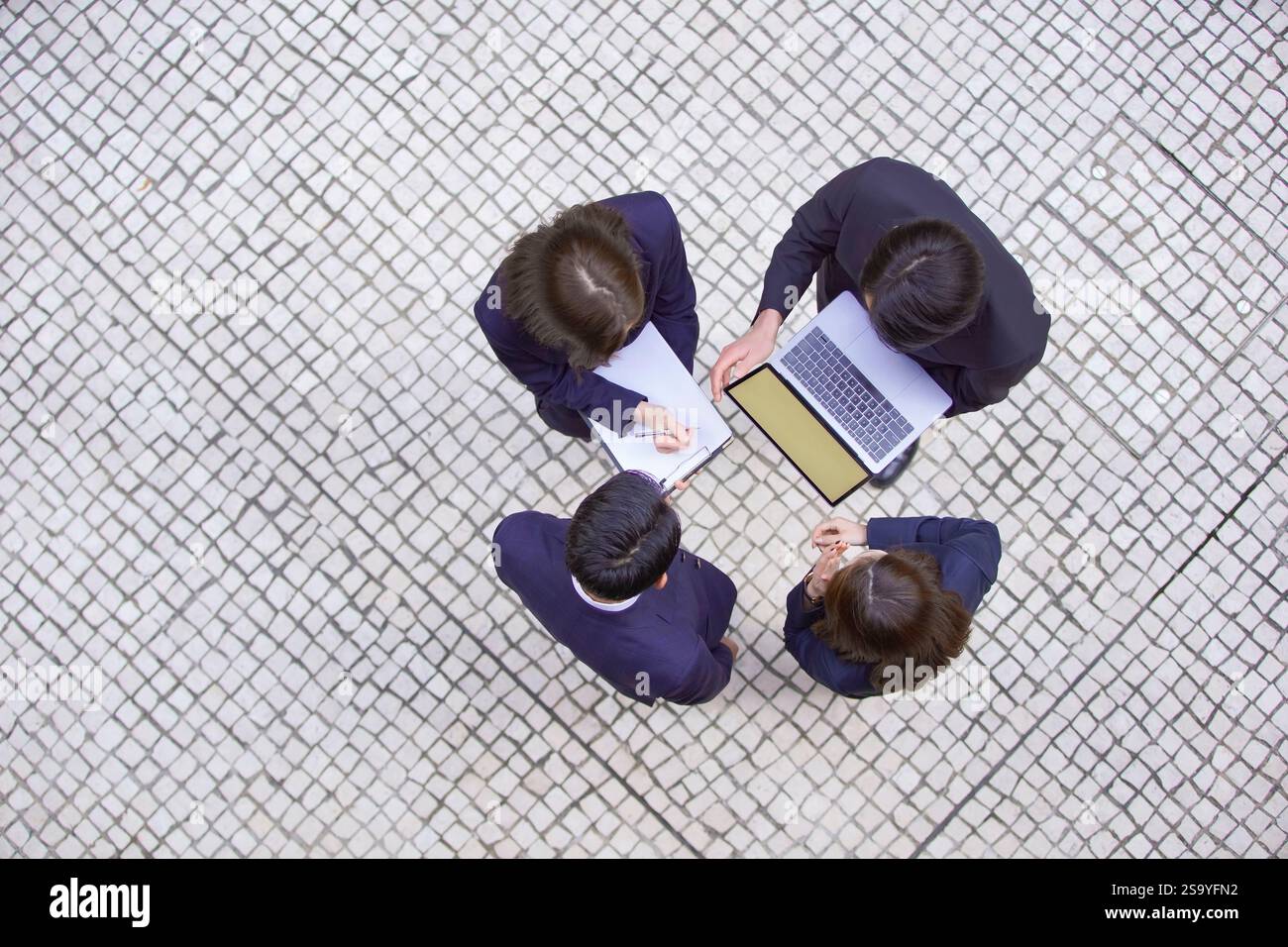 Business scene, team of four, meeting Stock Photo - Alamy