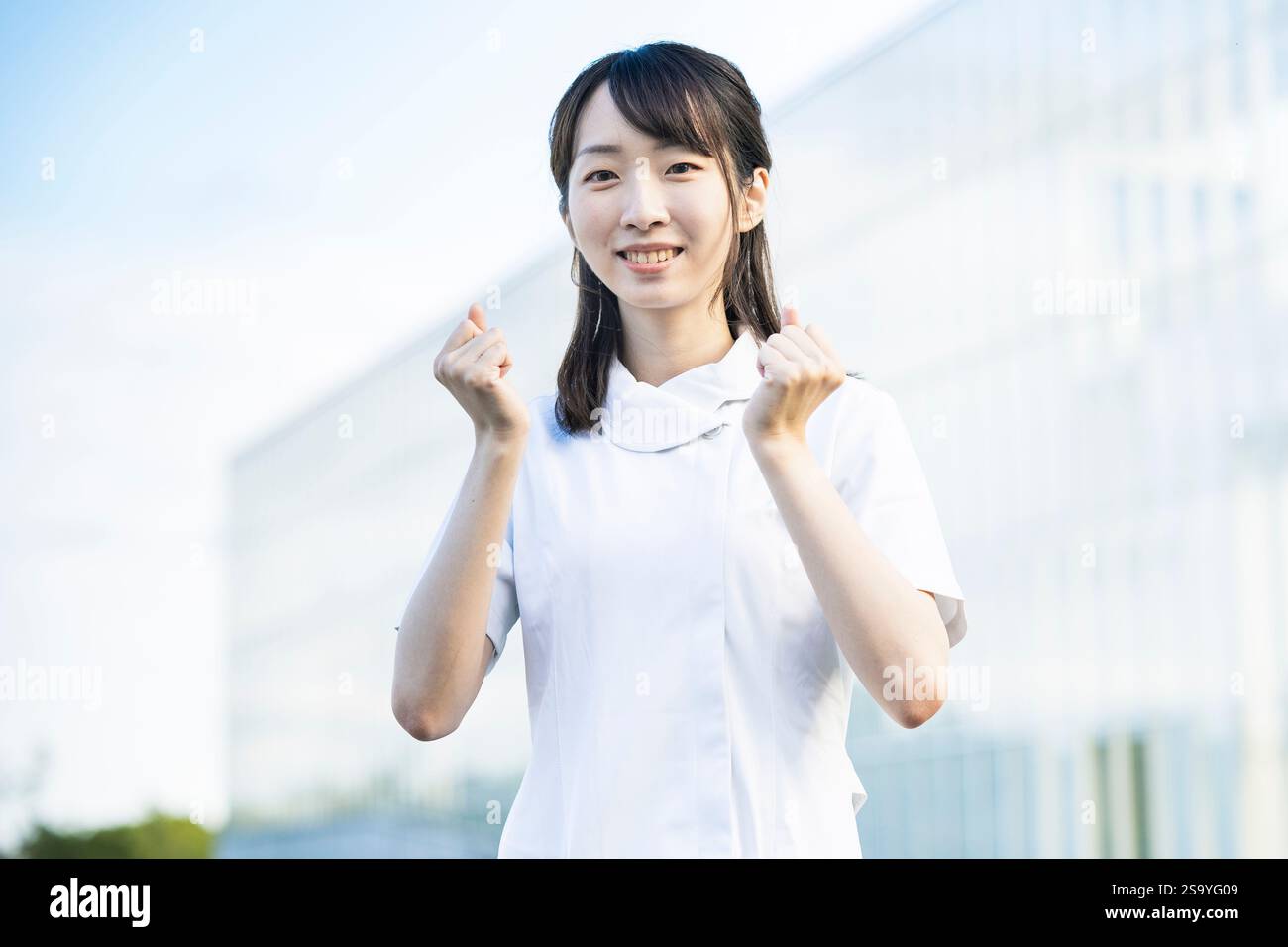 Woman in white posing with her guts Stock Photo - Alamy