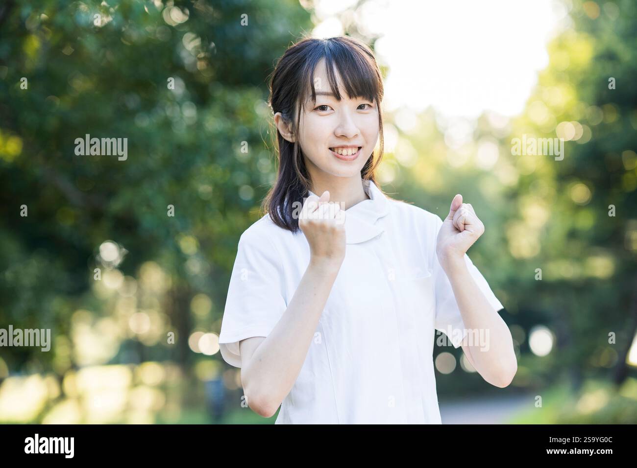 Woman in white posing with her guts Stock Photo - Alamy