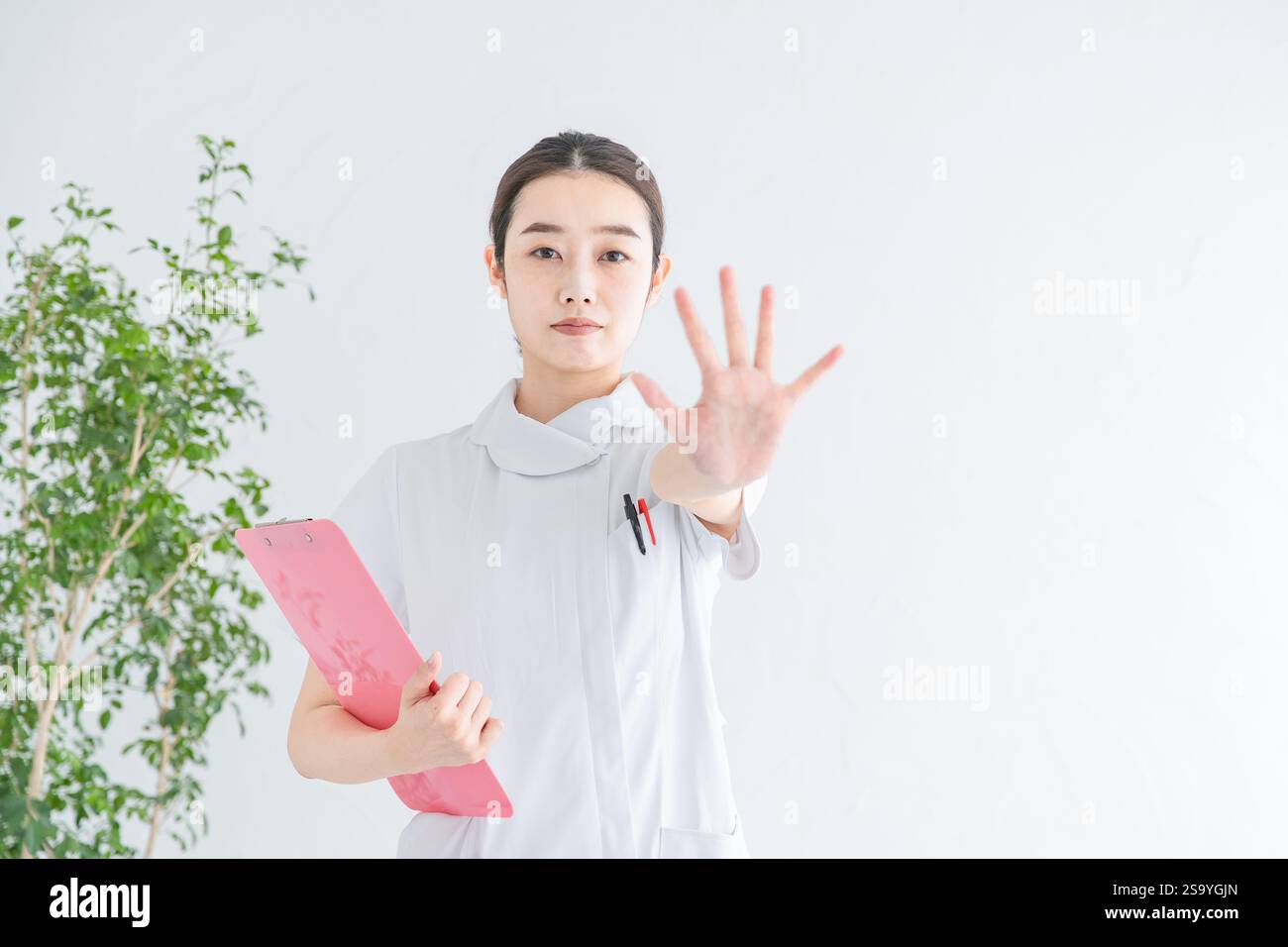 Woman in white posing for rejection Stock Photo - Alamy