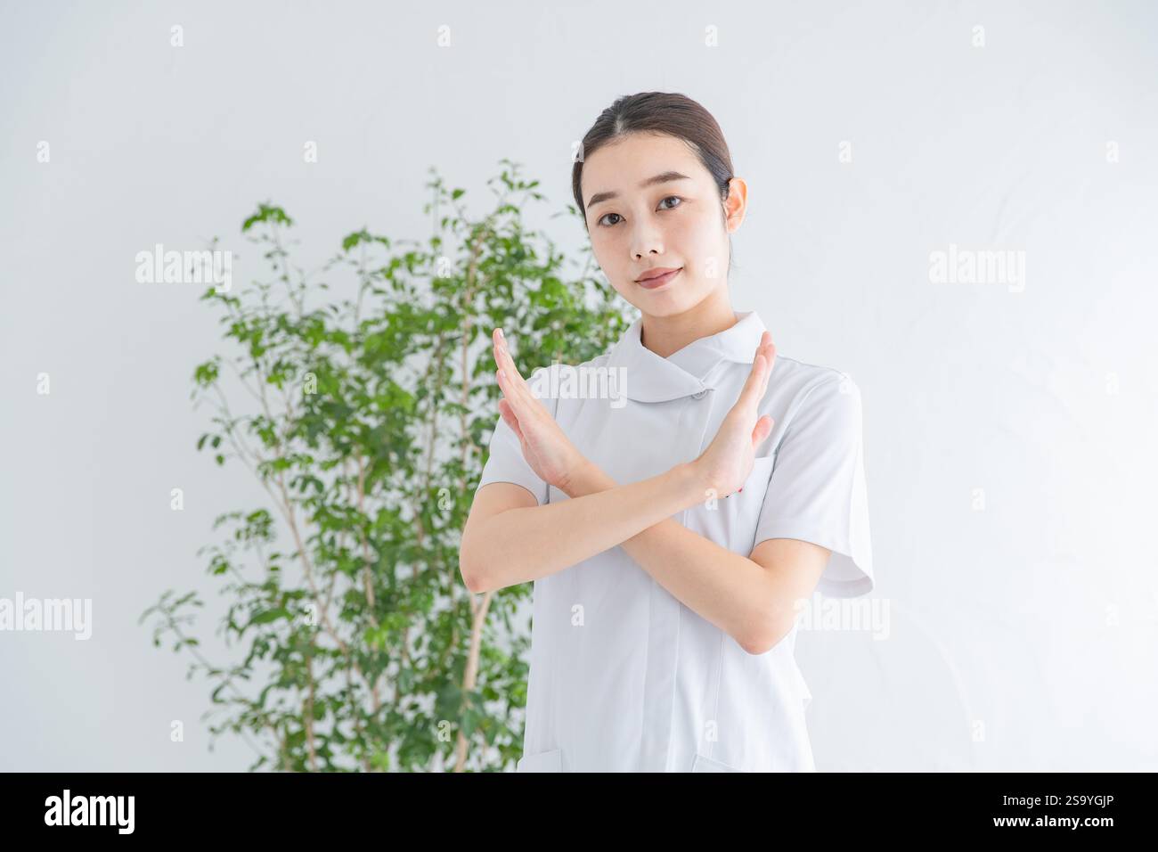 Woman in white posing for rejection Stock Photo - Alamy