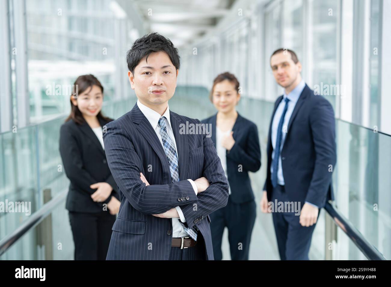 Business team with man in the centre Stock Photo - Alamy