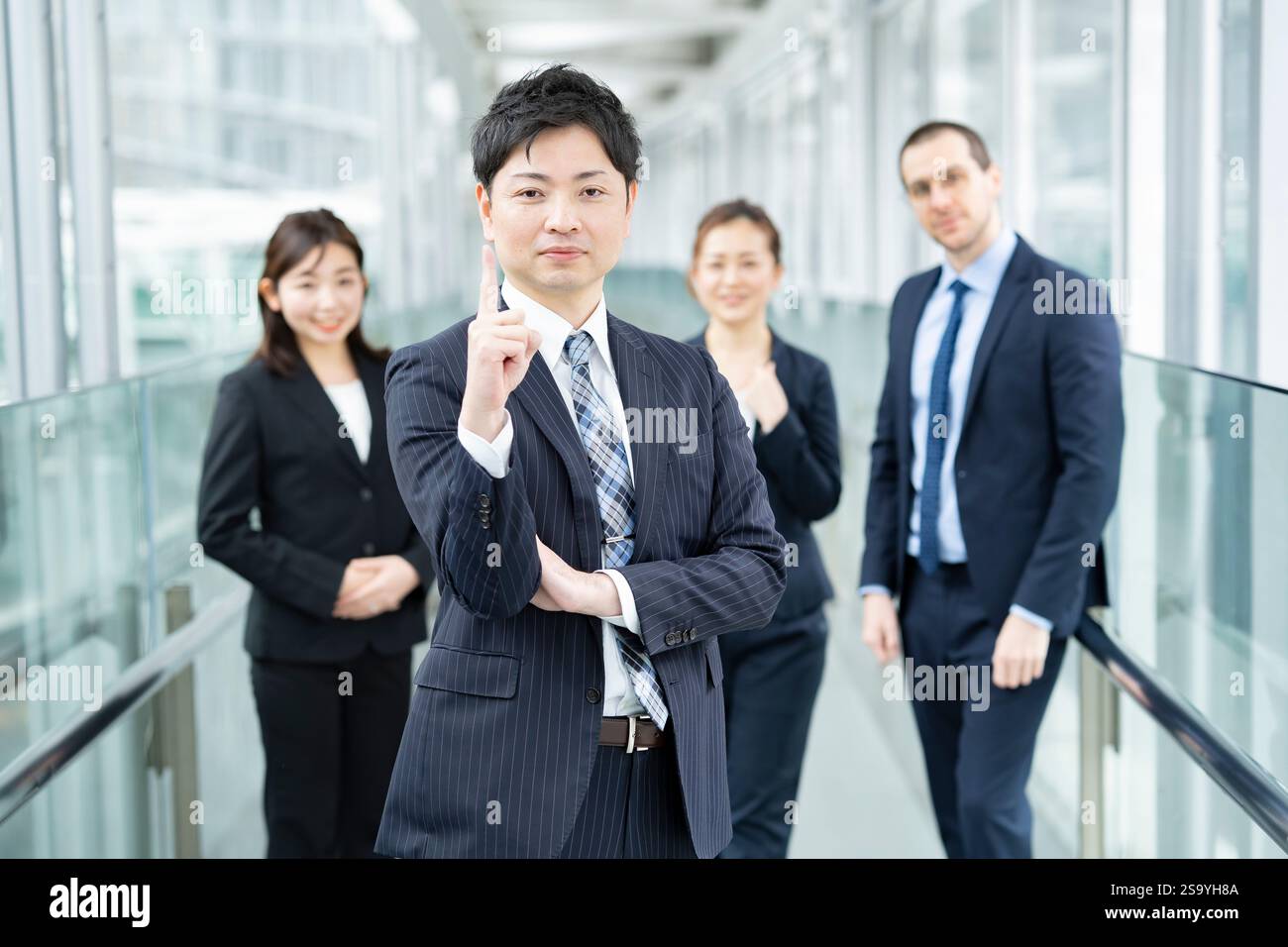 Business team with man in the centre Stock Photo - Alamy