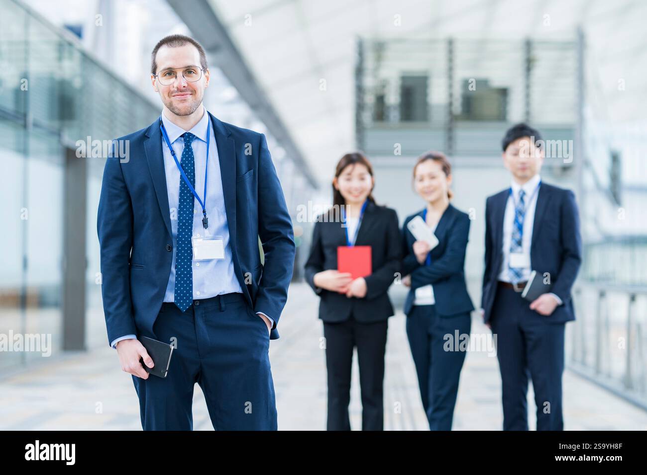 Business team with man in the centre Stock Photo - Alamy